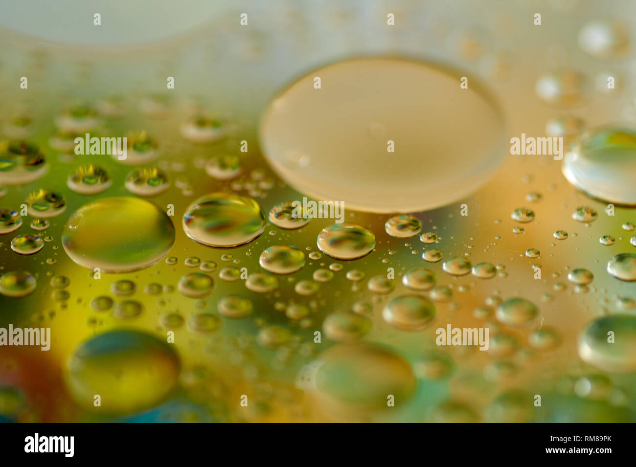 floating in the water abstract colorful, yellow oil drops Stock Photo ...