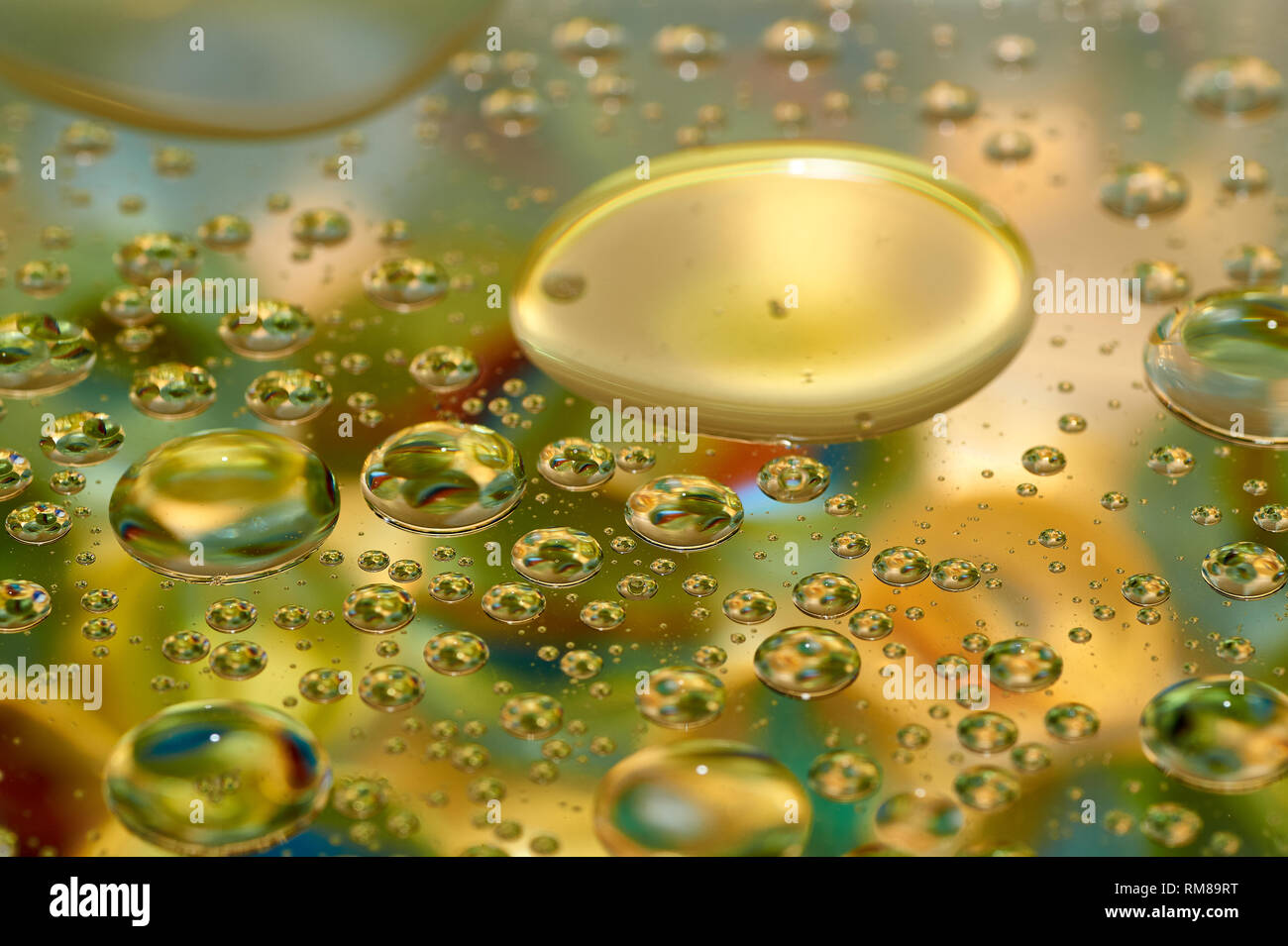 floating in the water abstract colorful, yellow oil drops Stock Photo ...