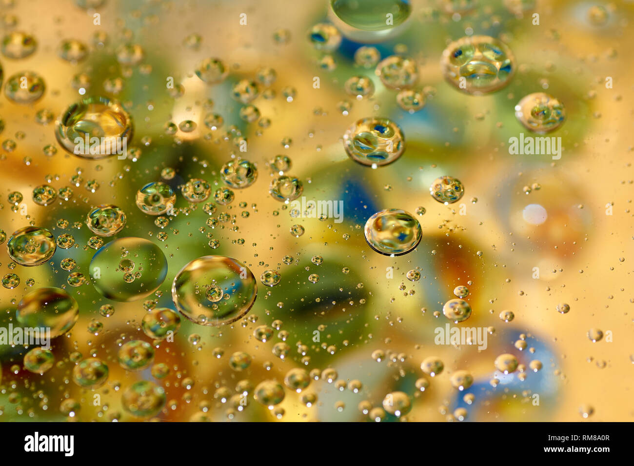 floating in the water abstract colorful, yellow oil drops Stock Photo ...