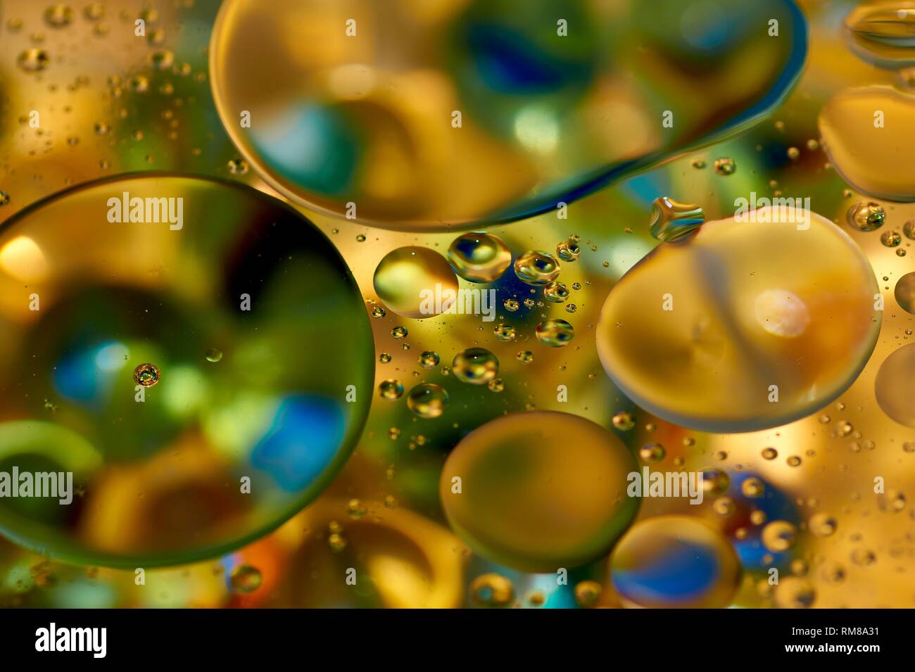 floating in the water abstract colorful, yellow oil drops Stock Photo ...