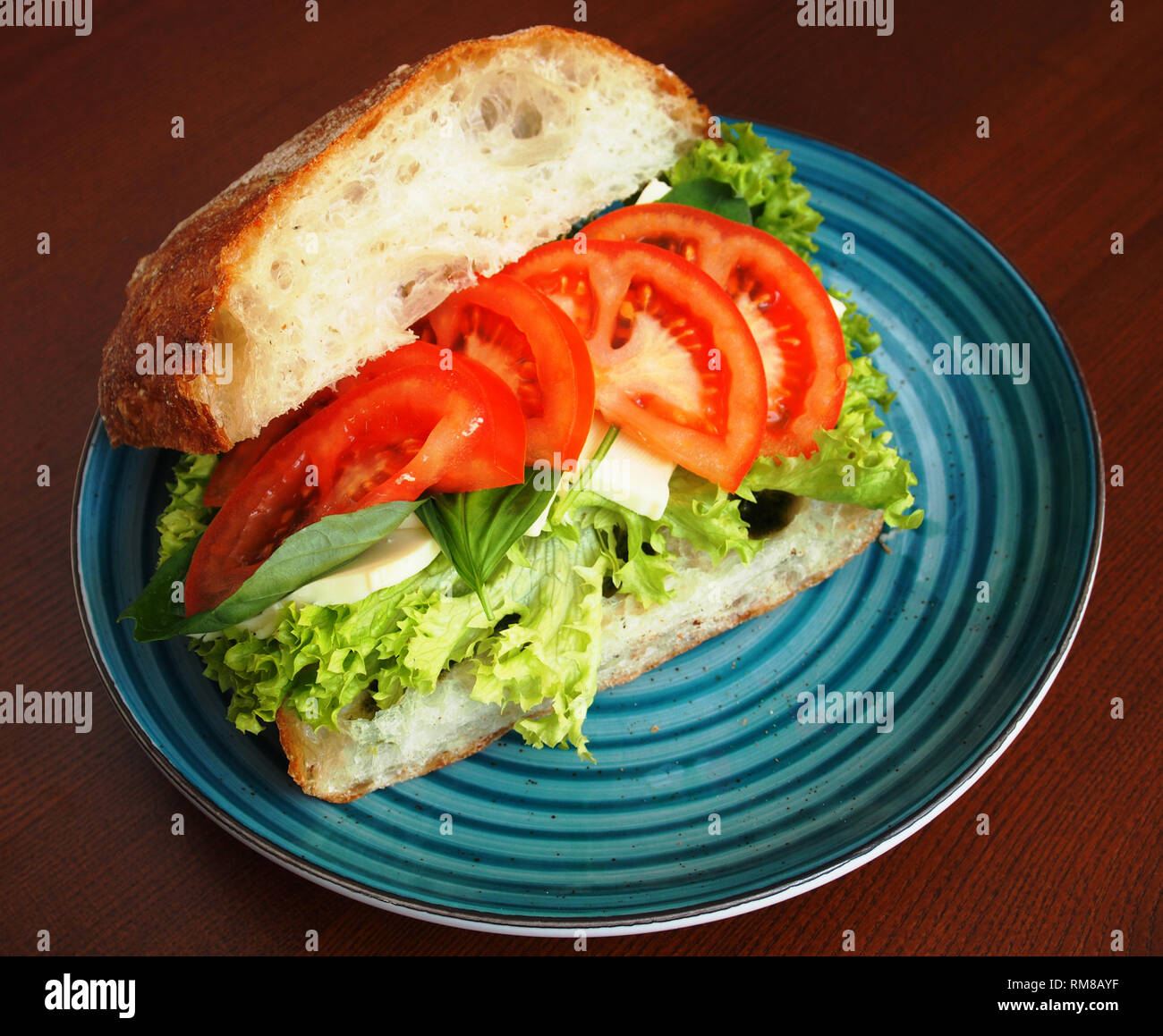 Sandwich with vegetables and white rustic bread on a large plate Stock ...