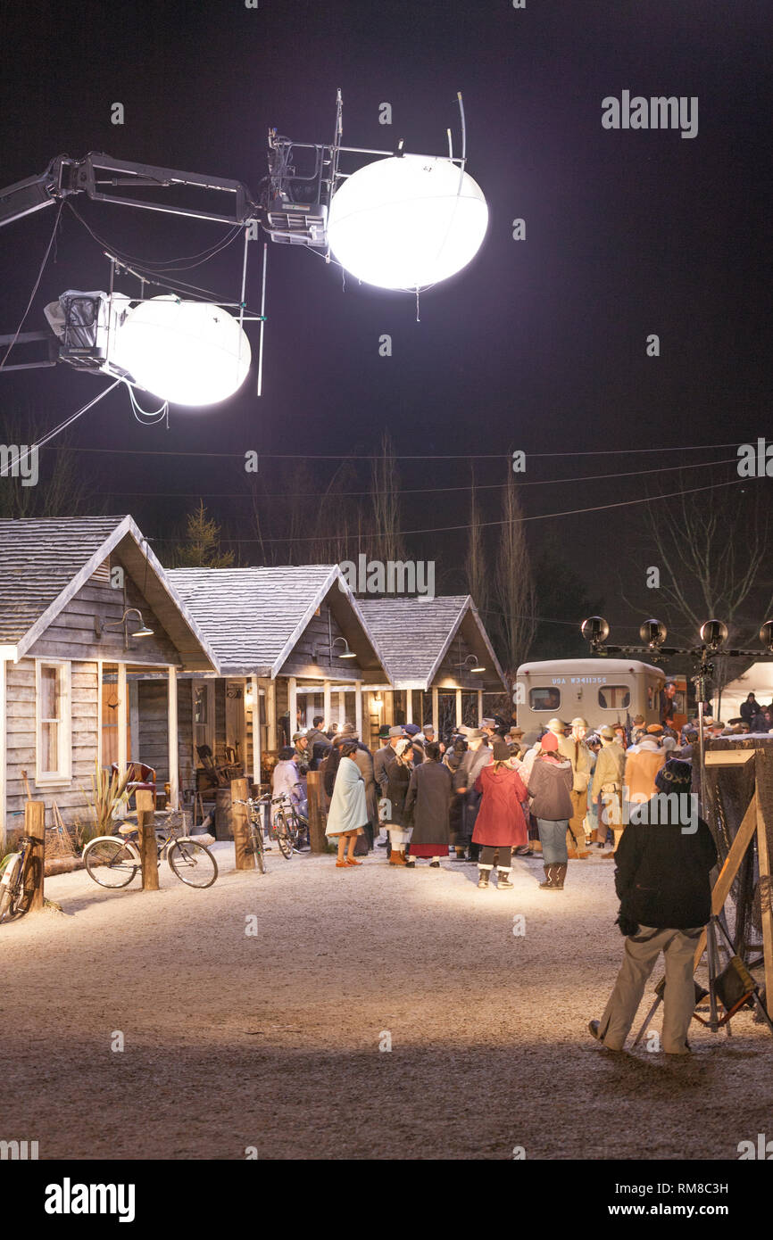 Filming a crowd scene at night with artificial lighting Stock Photo - Alamy