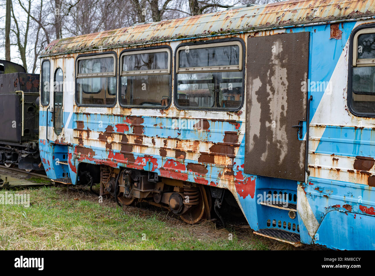 Old rusty wagon of the narrow gauge railway. Place of stationing of old ...