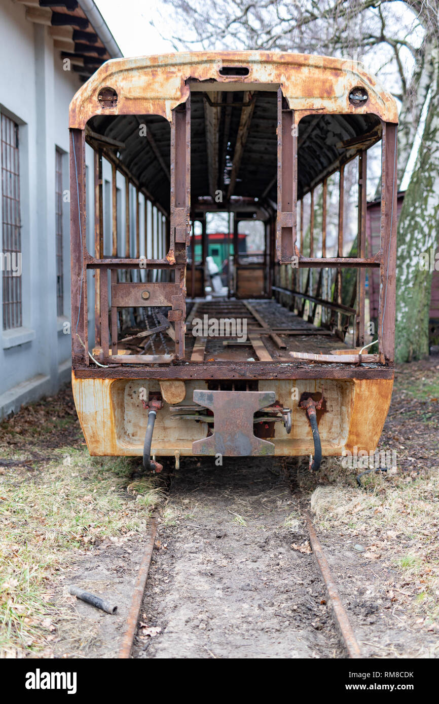 Old rusty wagon of the narrow gauge railway. Place of stationing of old ...