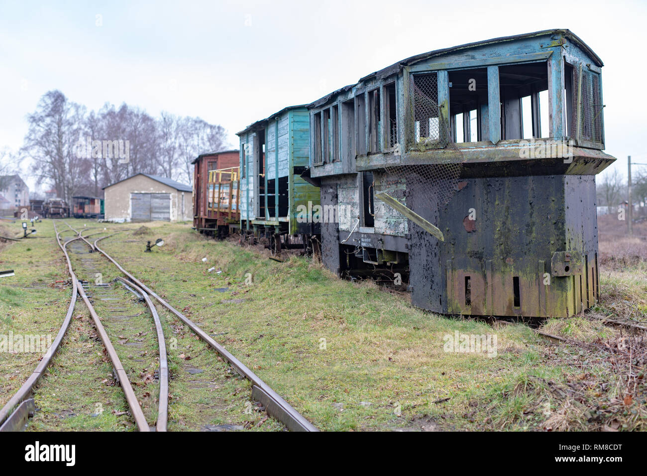 Old rusty wagon of the narrow gauge railway. Place of stationing of old ...