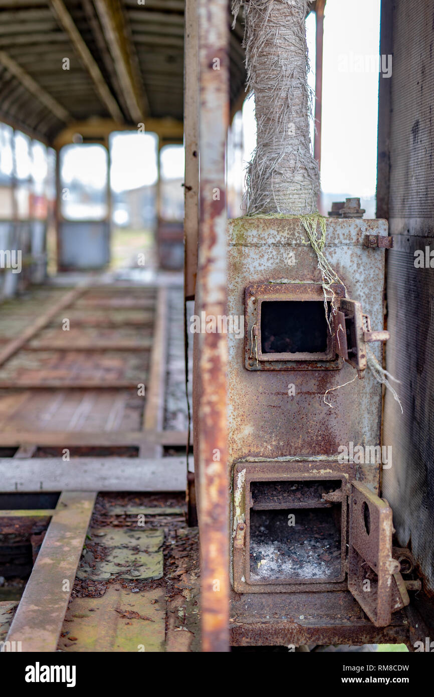 Old rusty wagon of the narrow gauge railway. Place of stationing of old ...