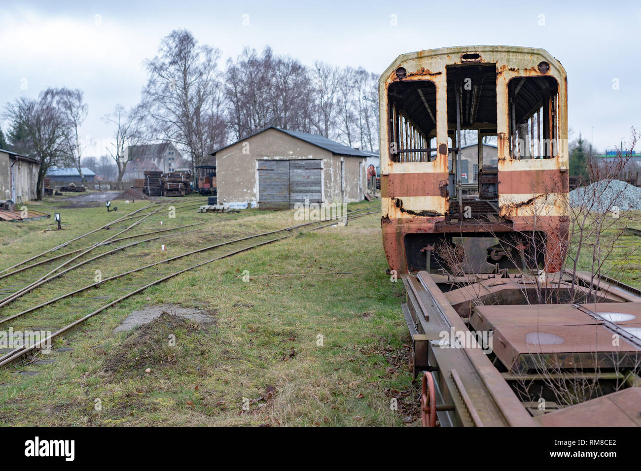 Old rusty wagon of the narrow gauge railway. Place of stationing of old ...