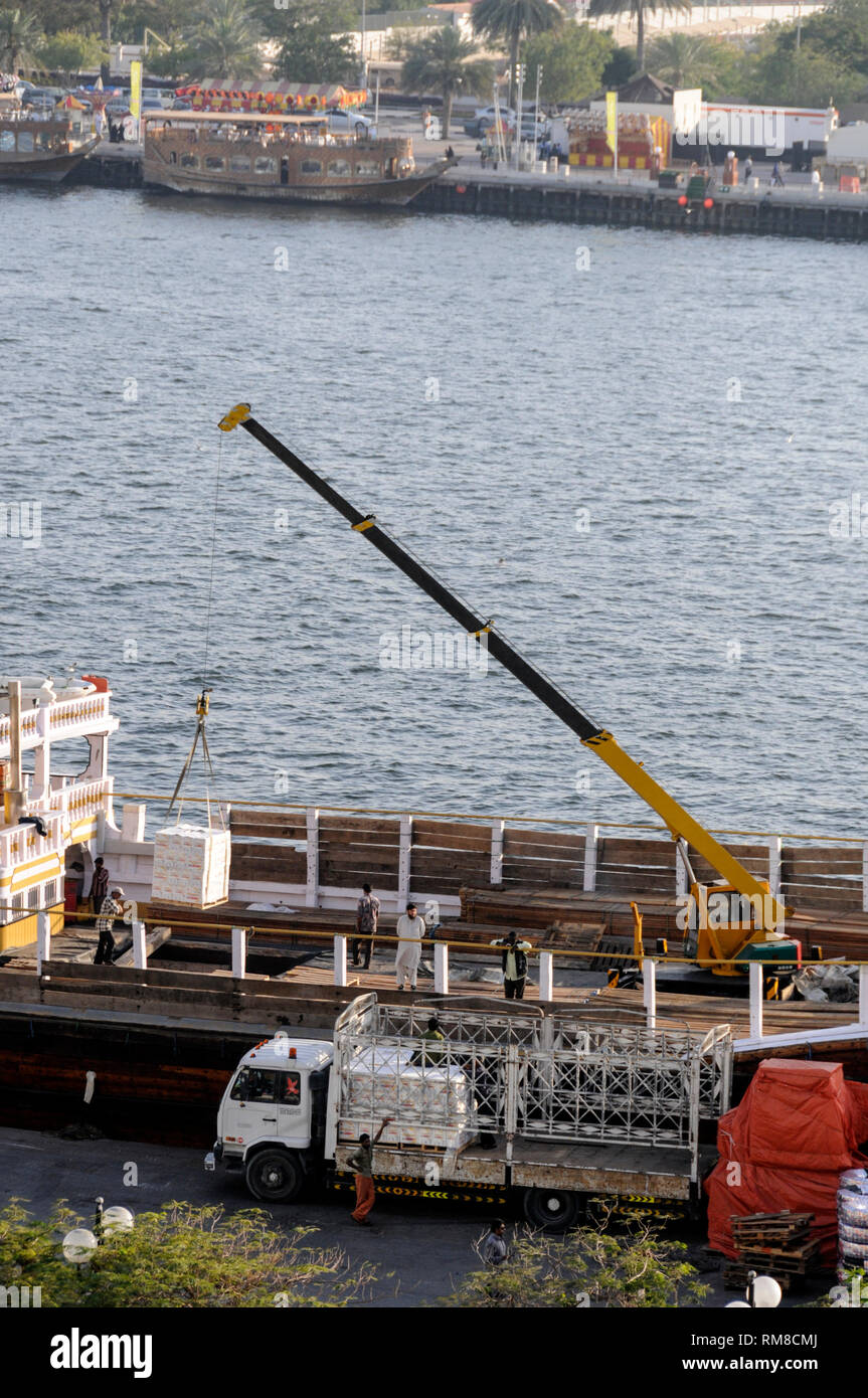 An Ocean going wooden Dhow ( Arab Boat) being loaded with cargo on the ...