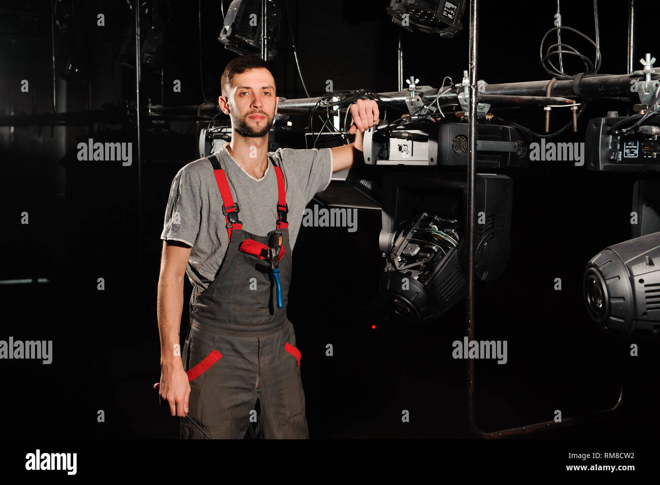The lighting engineer adjusts the lights on the stage Stock Photo - Alamy