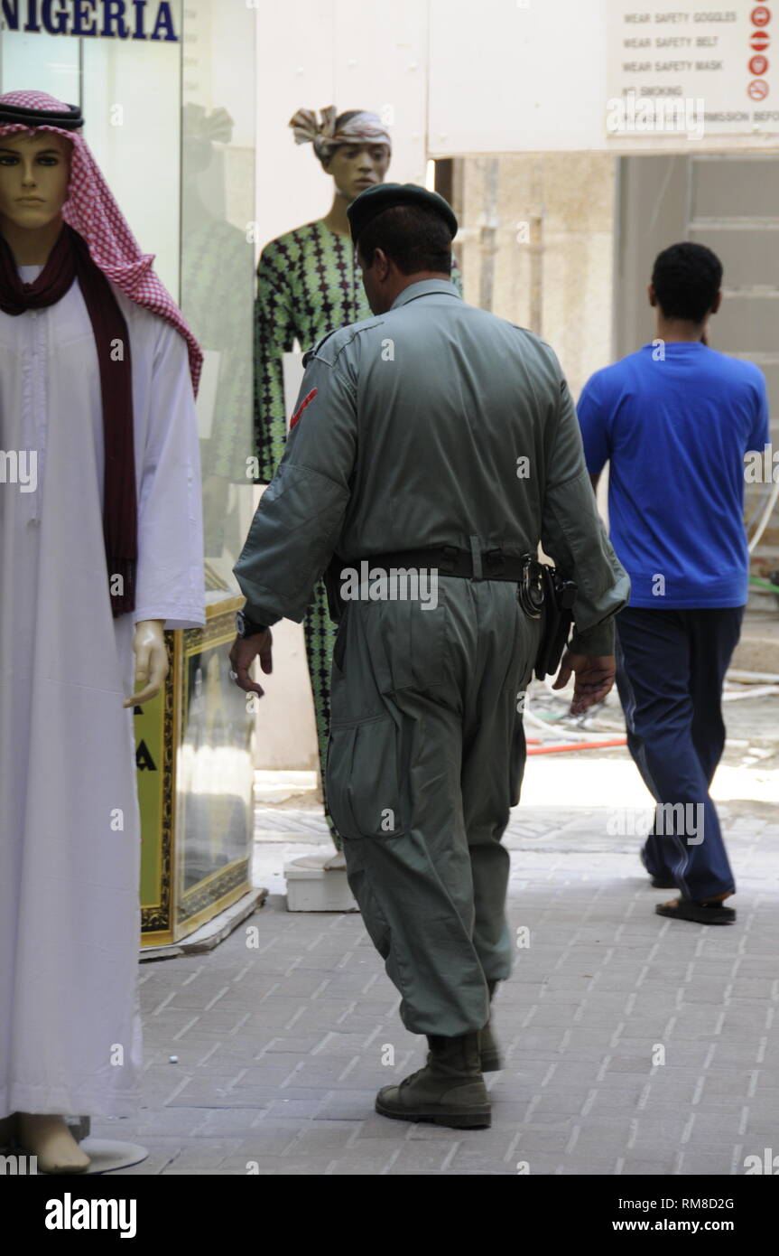 A Dubai policeman in the Gold Souk in Dubaiat the Dubai Gold Souk in ...