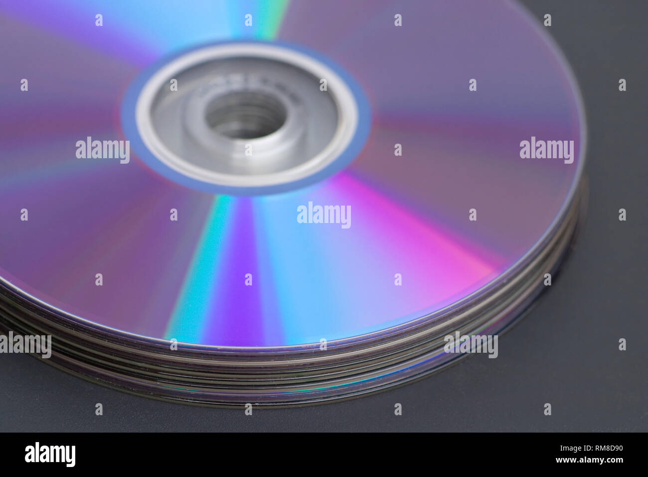 Stack of computer DVD disks isolated on black closeup Stock Photo - Alamy