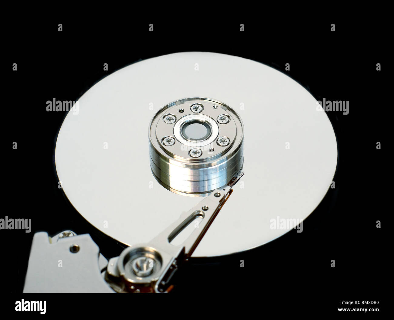 Computer hard disk with opened cover isolated on black Stock Photo - Alamy