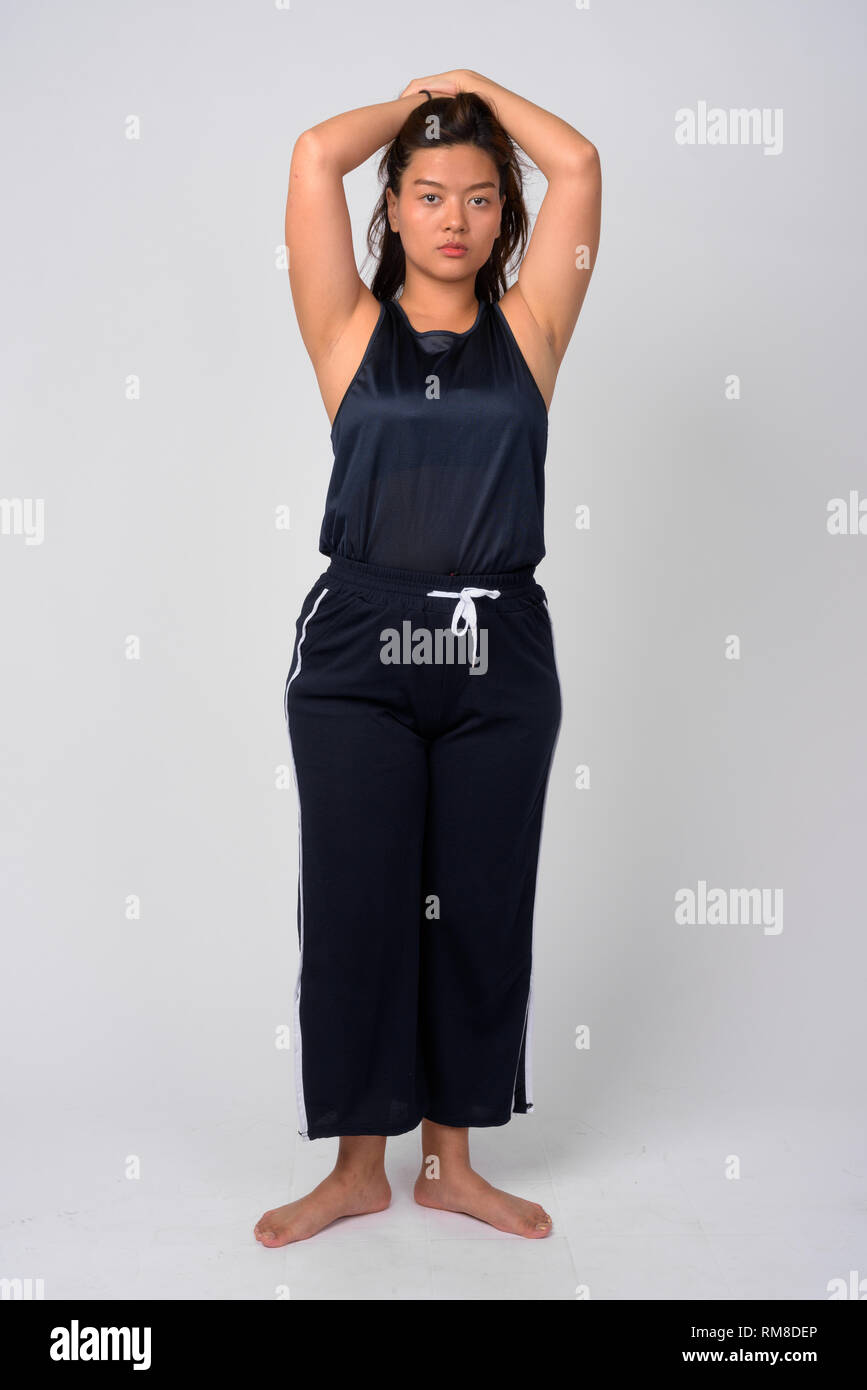 Full body shot of young beautiful Asian woman standing Stock Photo - Alamy