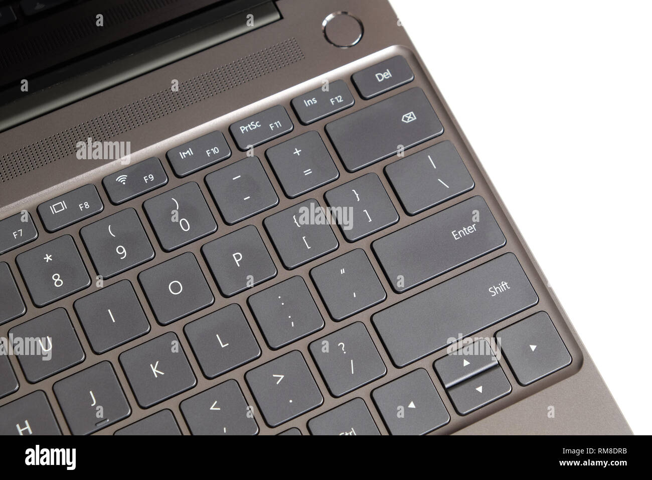 Part of opened laptop with keyboard, touchpad and empty mirror screen ...