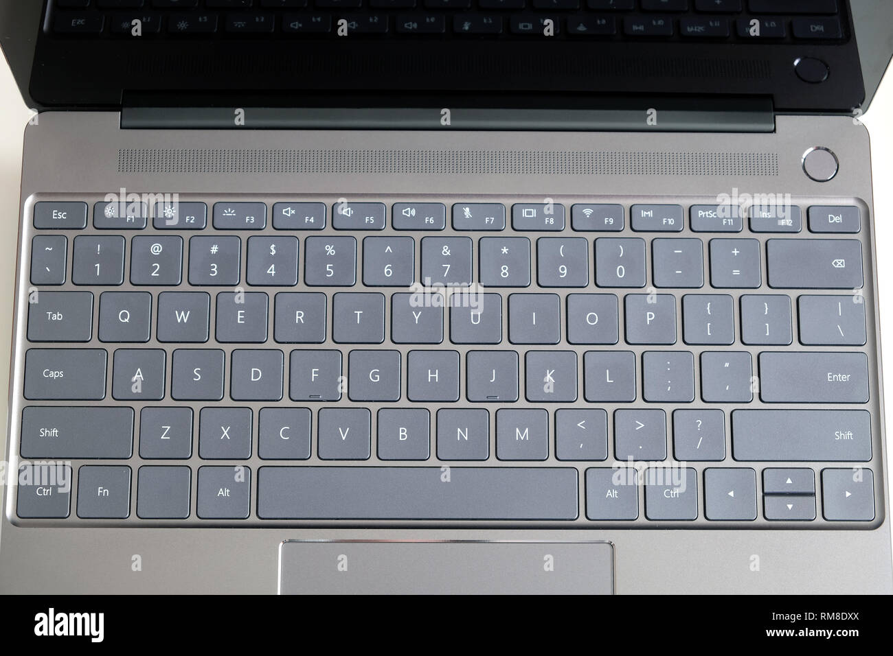 Opened modern laptop keyboard with USA alphabet on keys front top view ...
