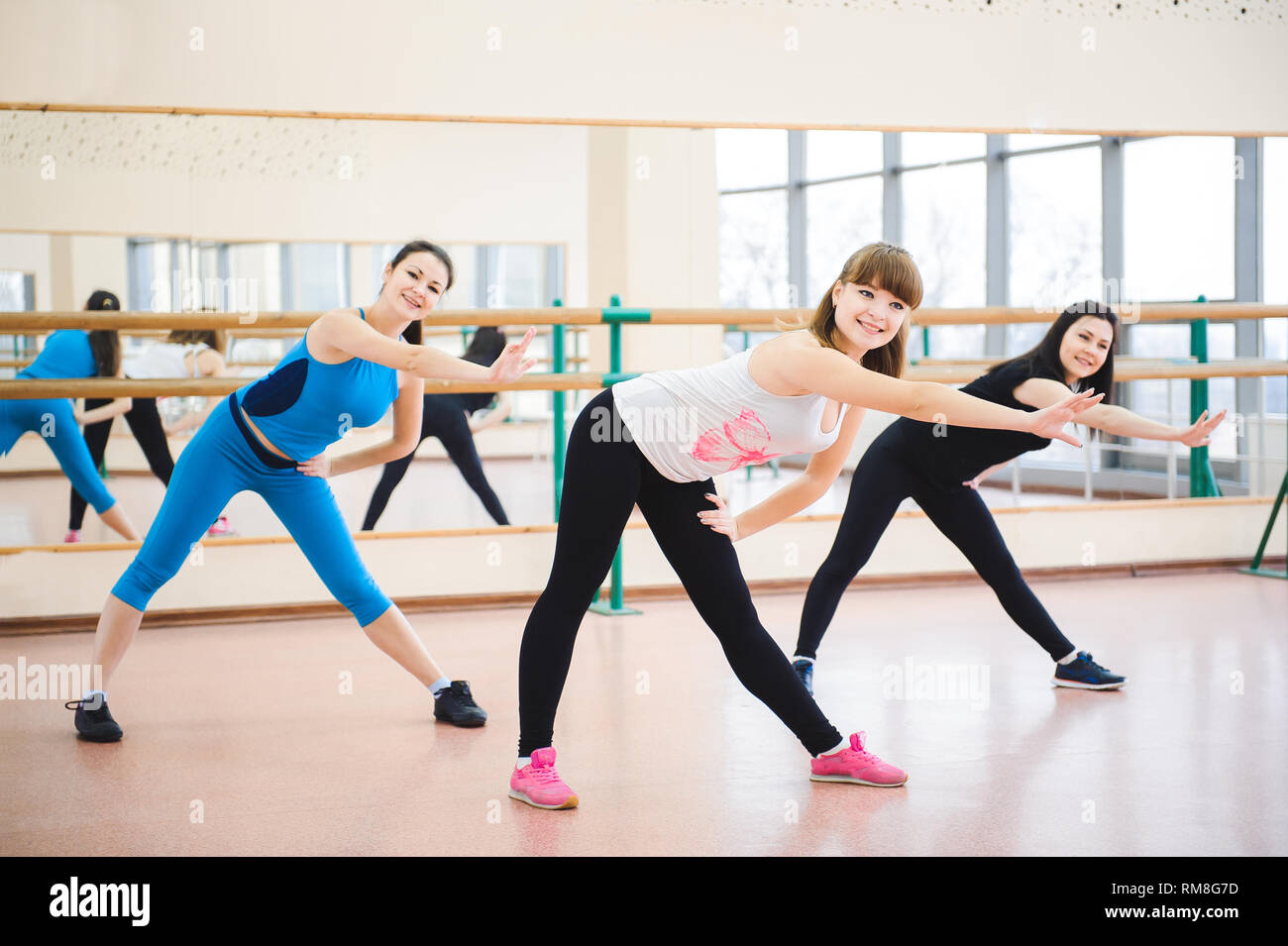 Group of people at the gym in the stretching class Stock Photo - Alamy