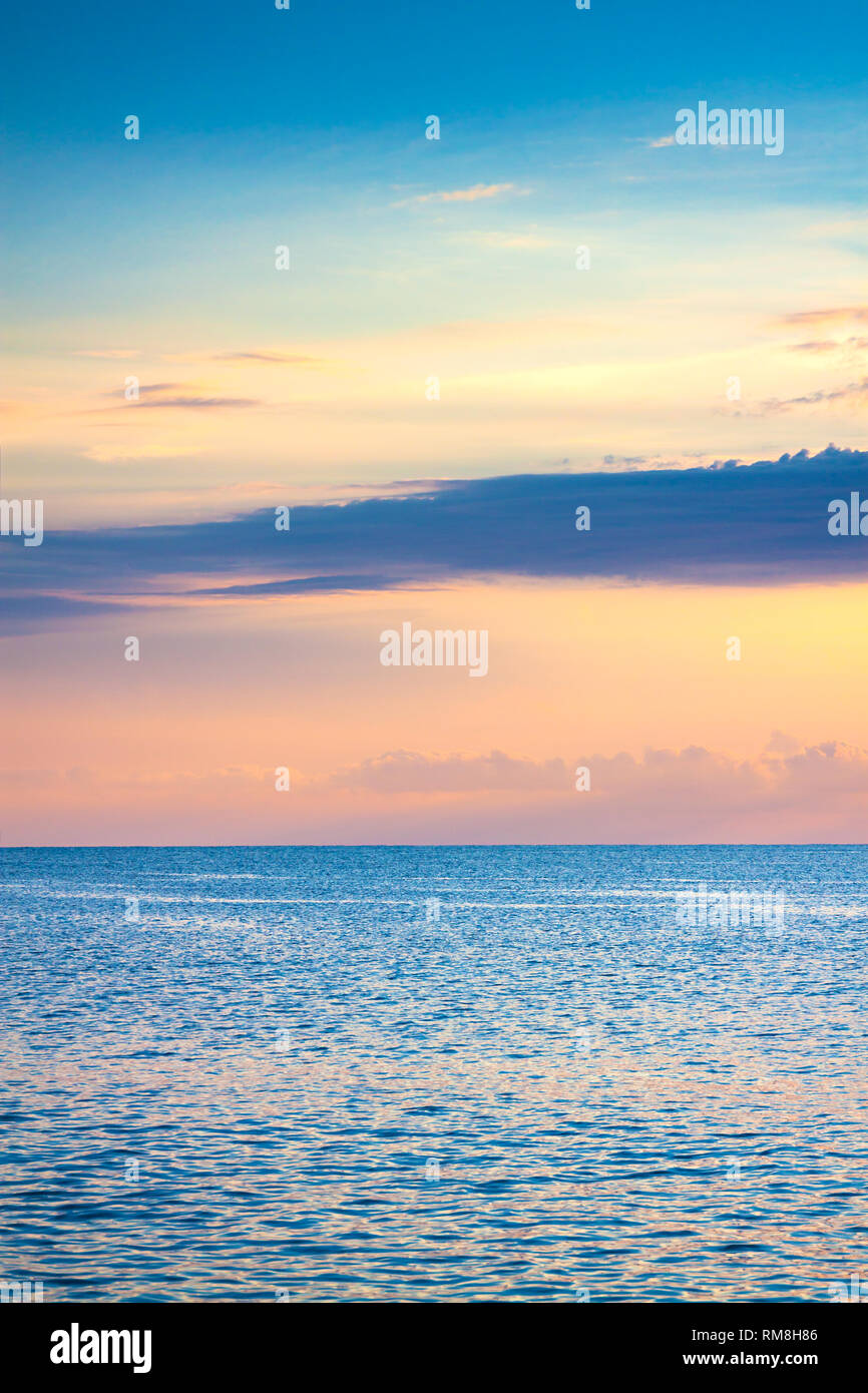 beautiful sea landscape with a sunset. evening sky with clouds over ...