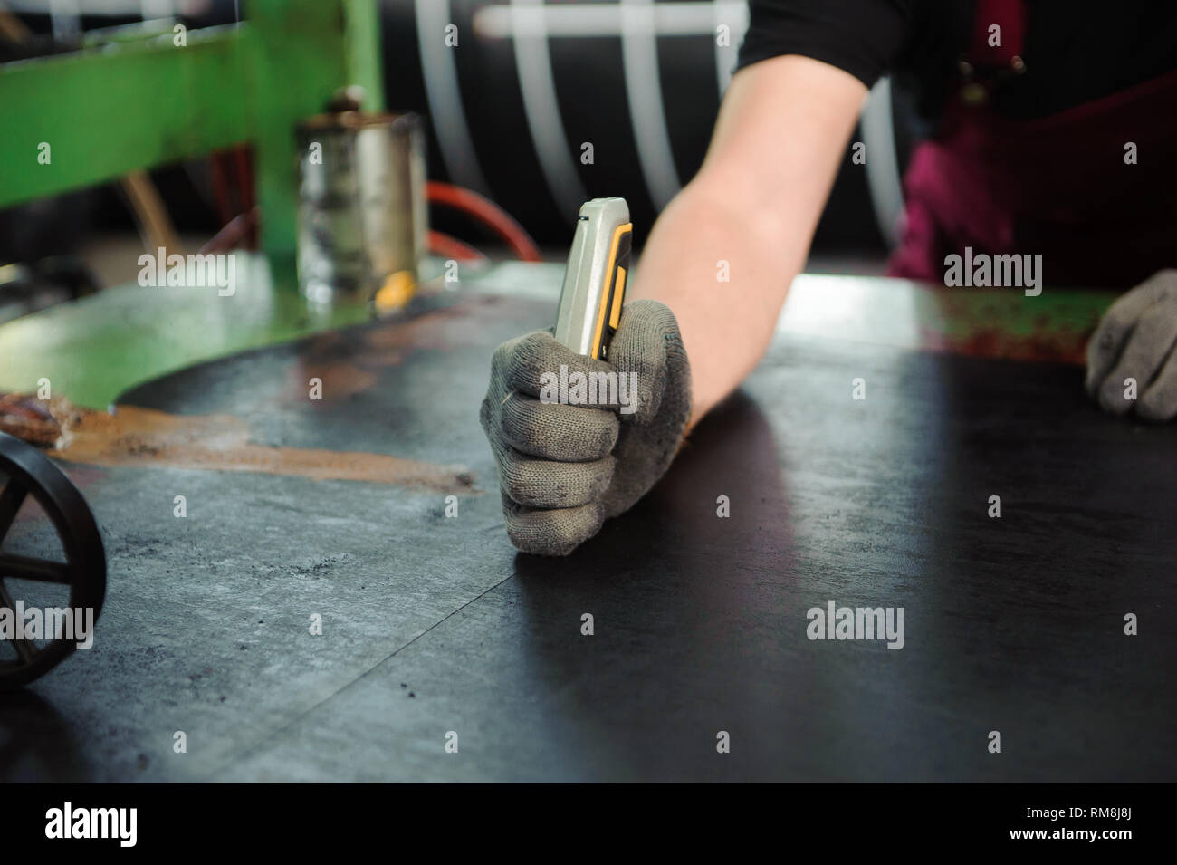 Worker tests production on the rubber factory Stock Photo - Alamy
