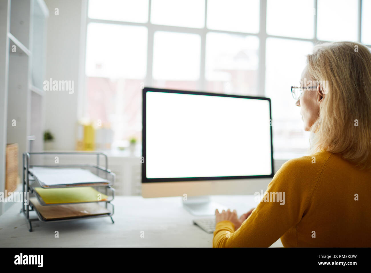 Businesswoman Looking at Blank Screen Stock Photo - Alamy