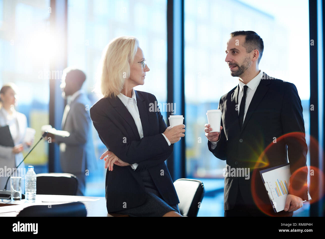 Conversation at break Stock Photo - Alamy
