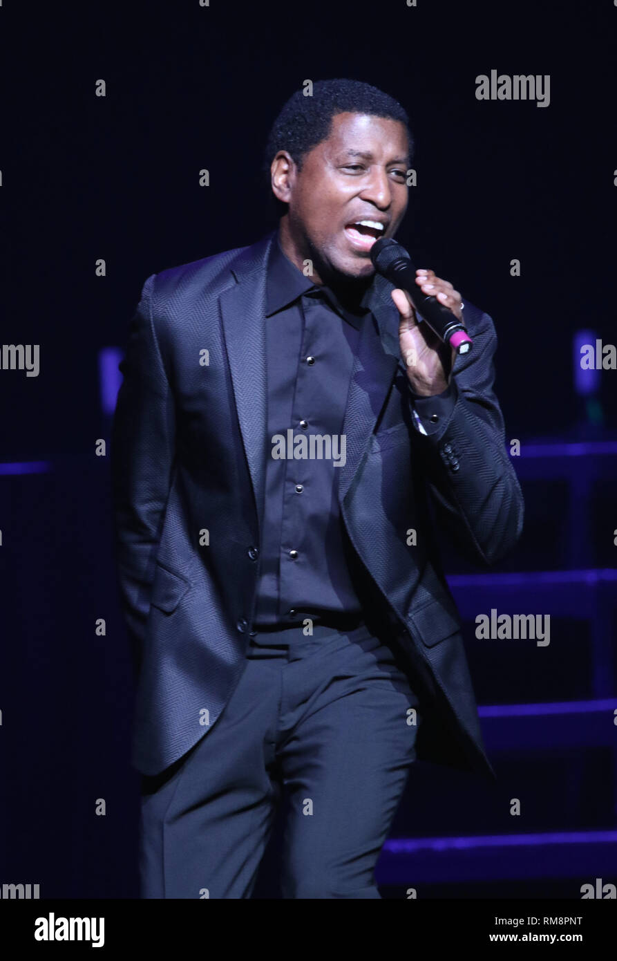 Singer Babyface is shown performing onstage during a live concert ...