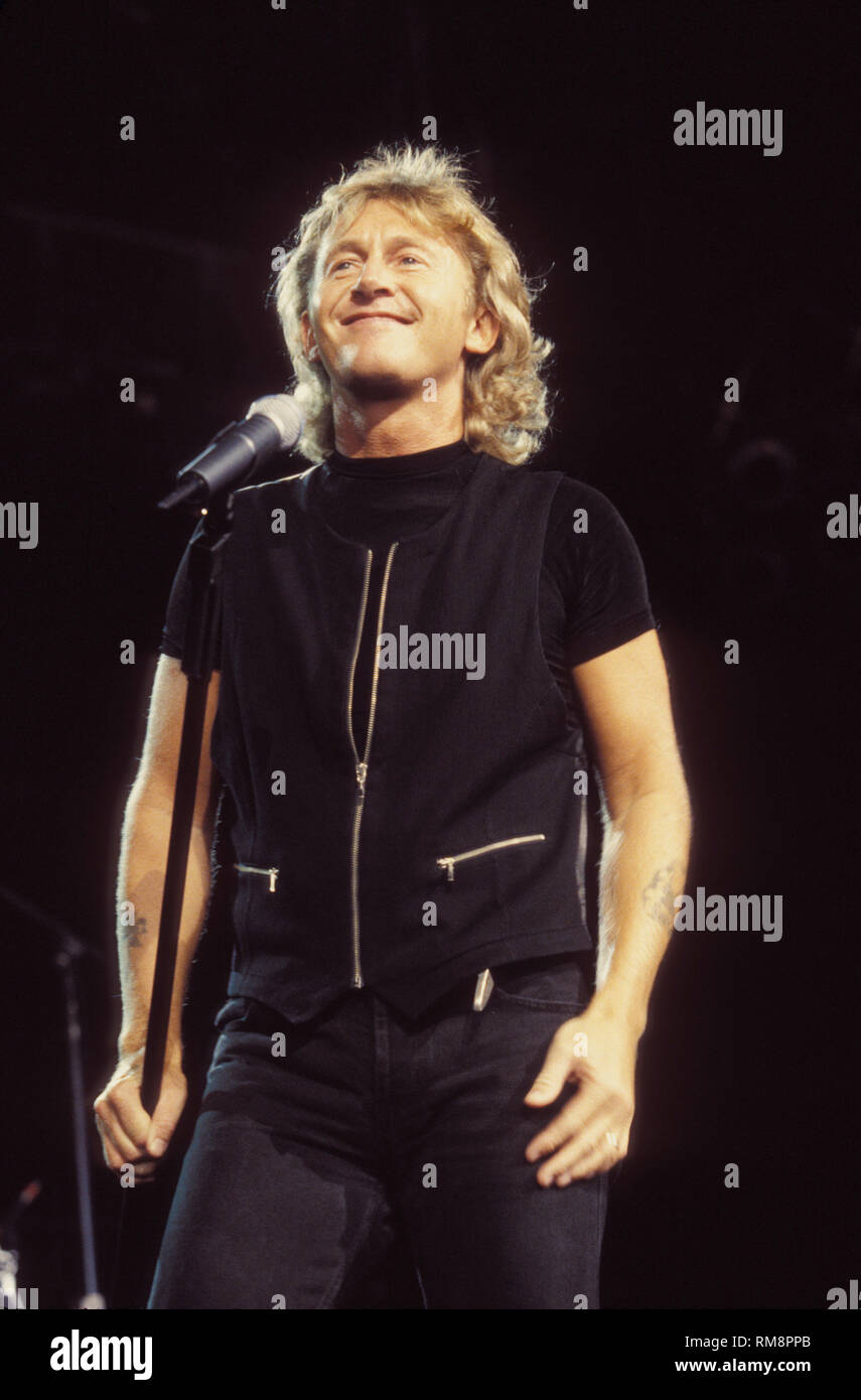 Bad Company singer Robert Hart is shown singing "live" in concert Stock ...