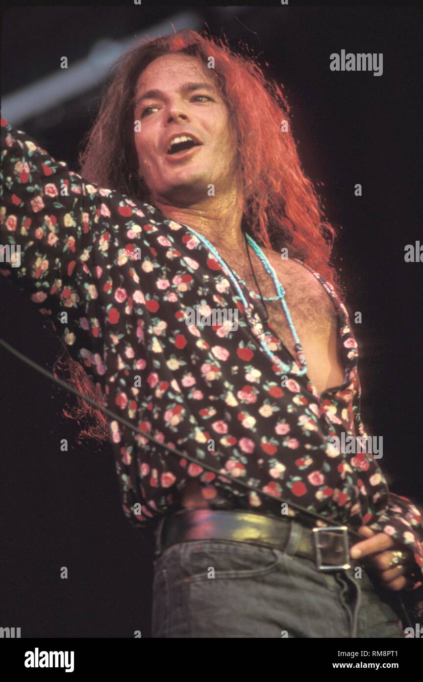 Badlands vocalist (name ?) is shown onstage during s concert ...