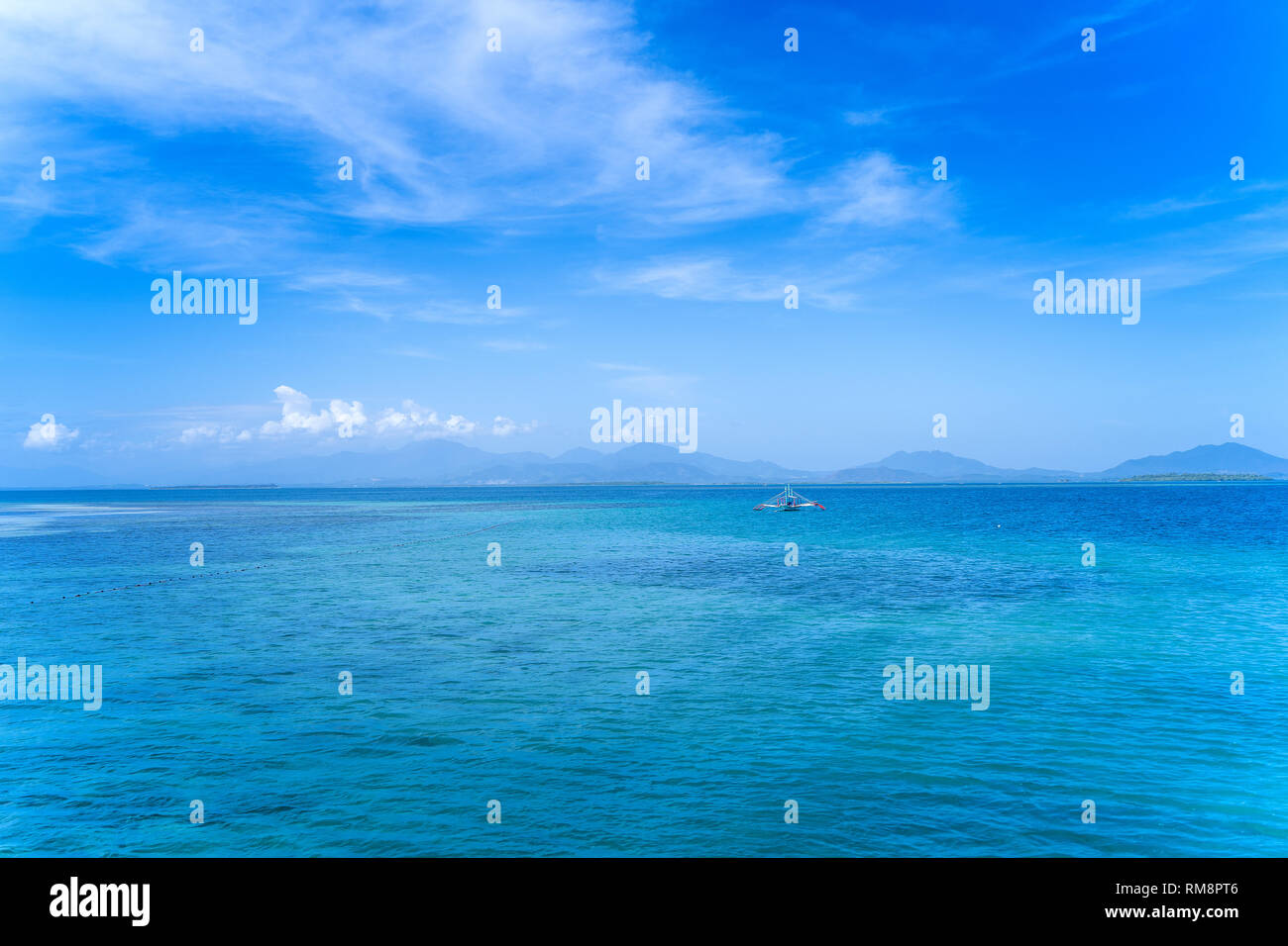 Beautiful ocean scene view isolated with light blue sky background ...