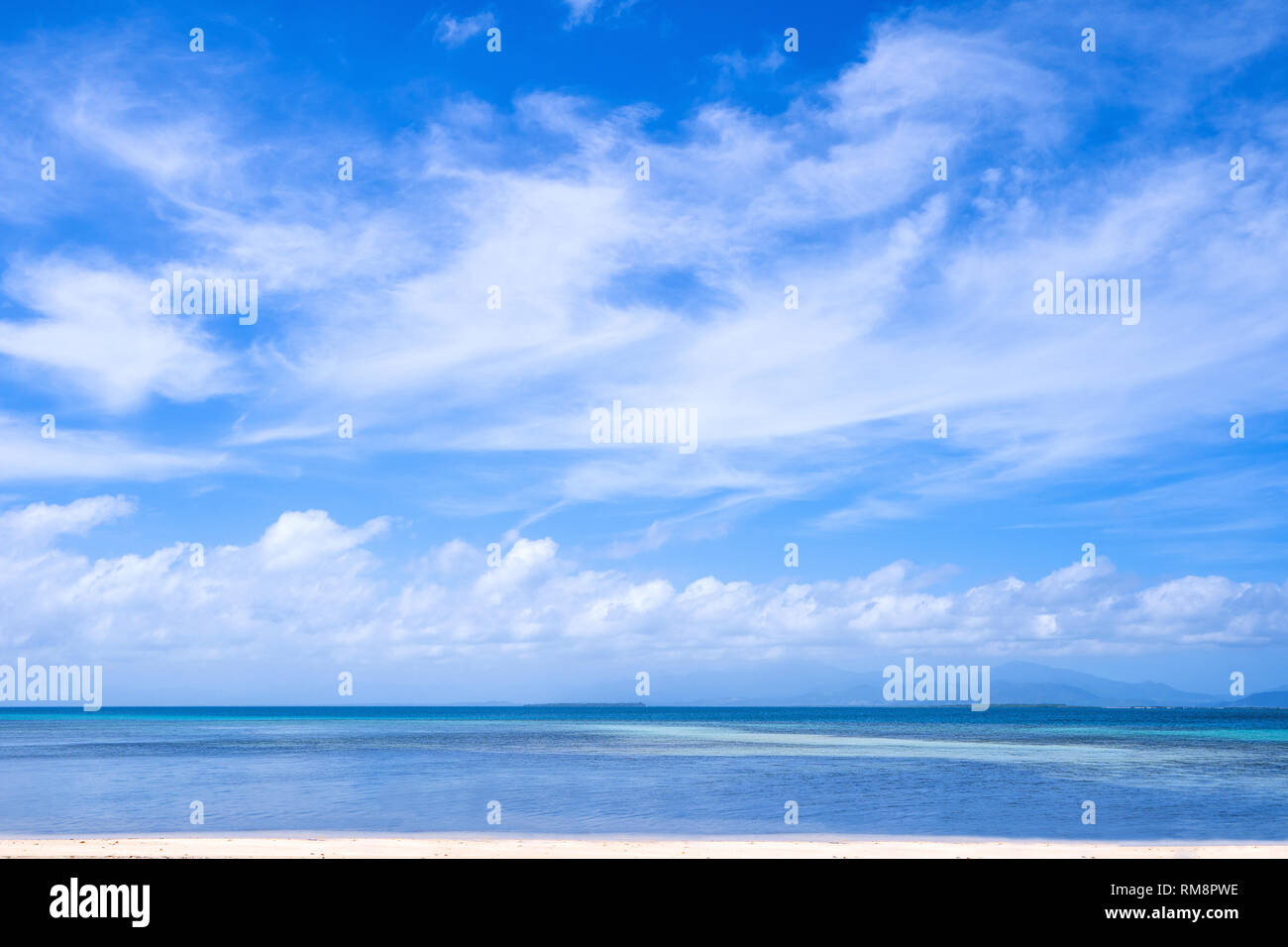 Beautiful ocean scene view isolated with light blue sky background ...