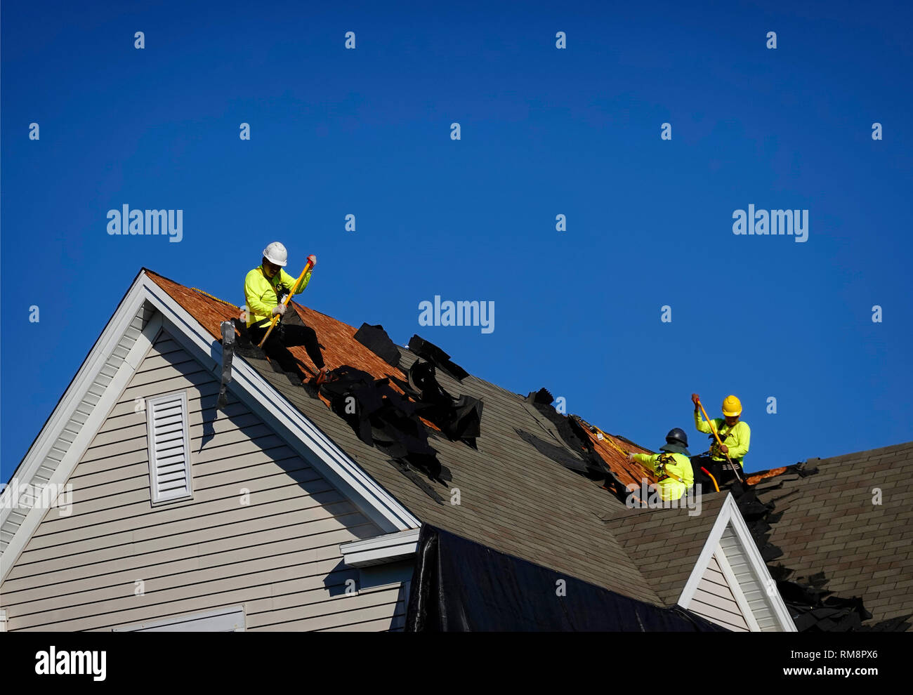 roofers removing a old roof on assisted living building in Southington ...