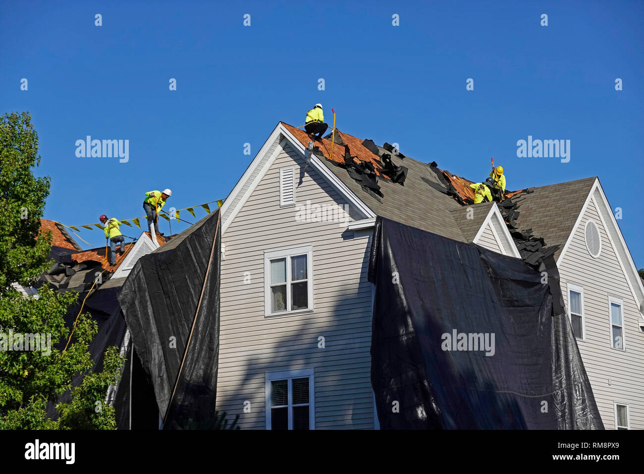 roofers removing a old roof on assisted living building in Southington ...