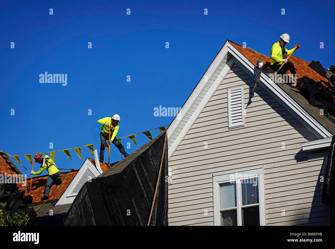 roofers removing a old roof on assisted living building in Southington ...