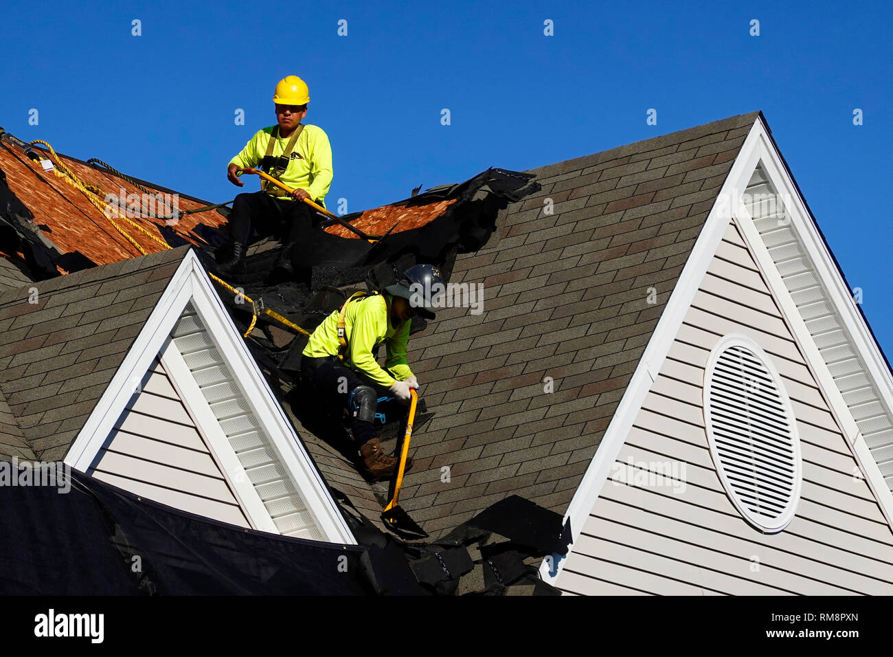 roofers removing a old roof on assisted living building in Southington ...