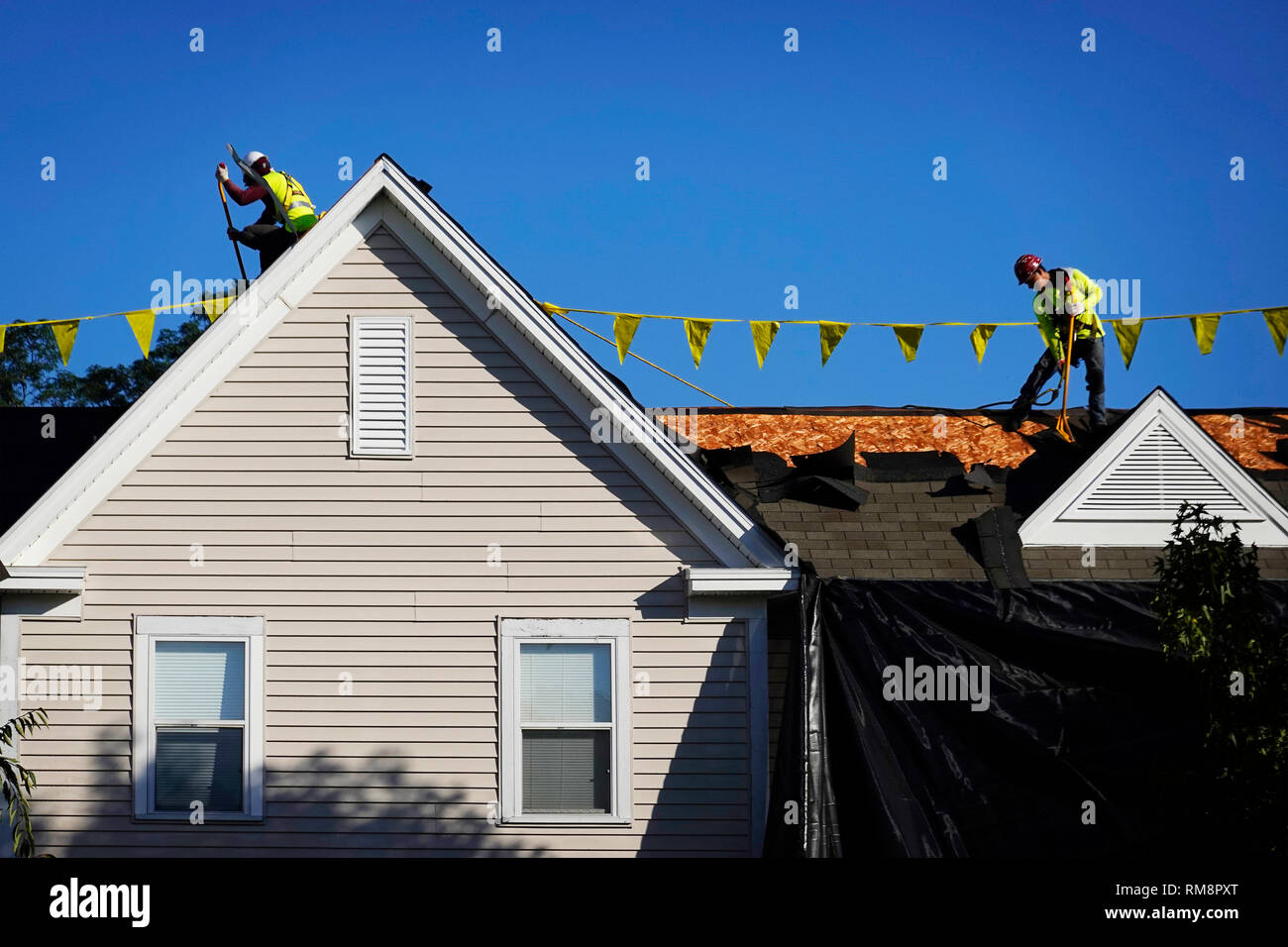 roofers removing a old roof on assisted living building in Southington ...