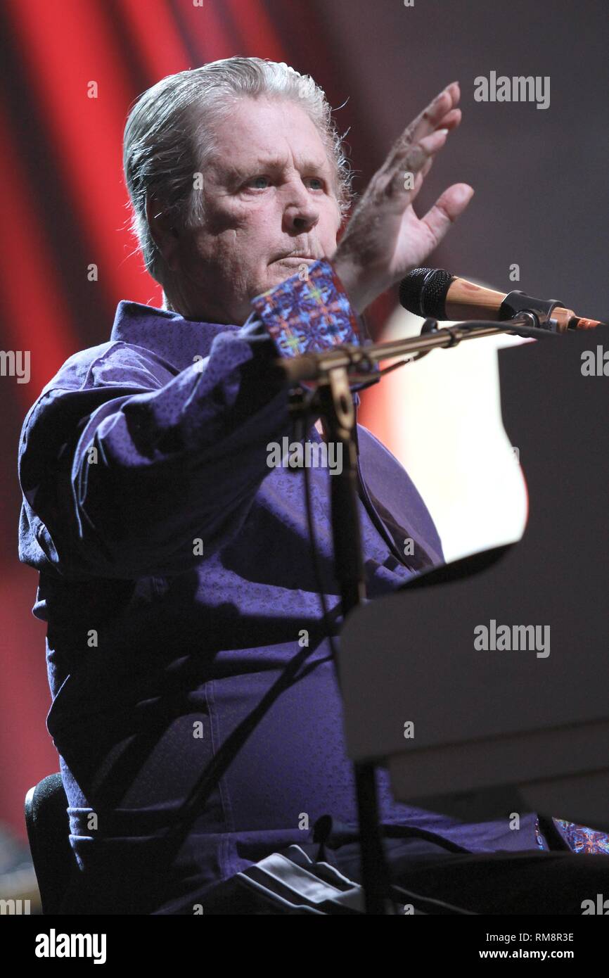 Musician Brian Wilson is shown performing on stage during a "live ...