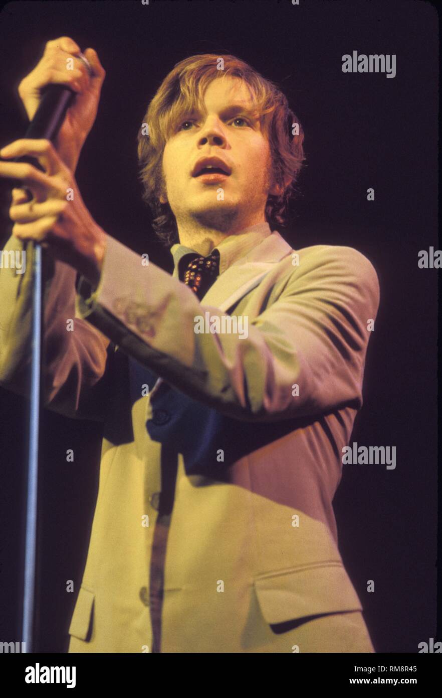 Beck is shown performing on stage during a "live" concert appearance ...