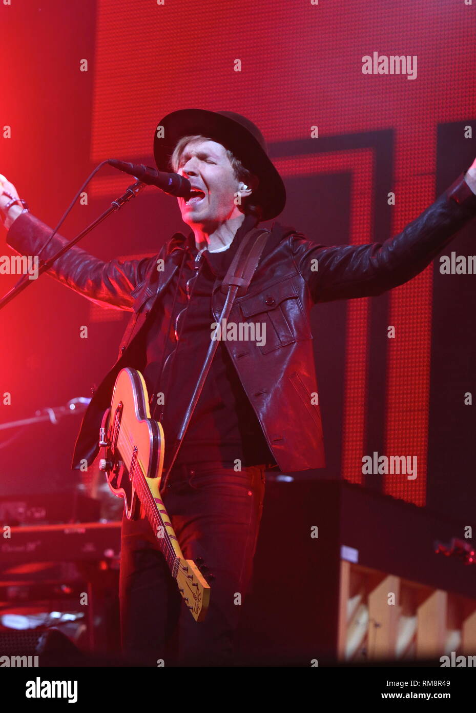Beck is shown performing on stage during a "live" concert appearance ...