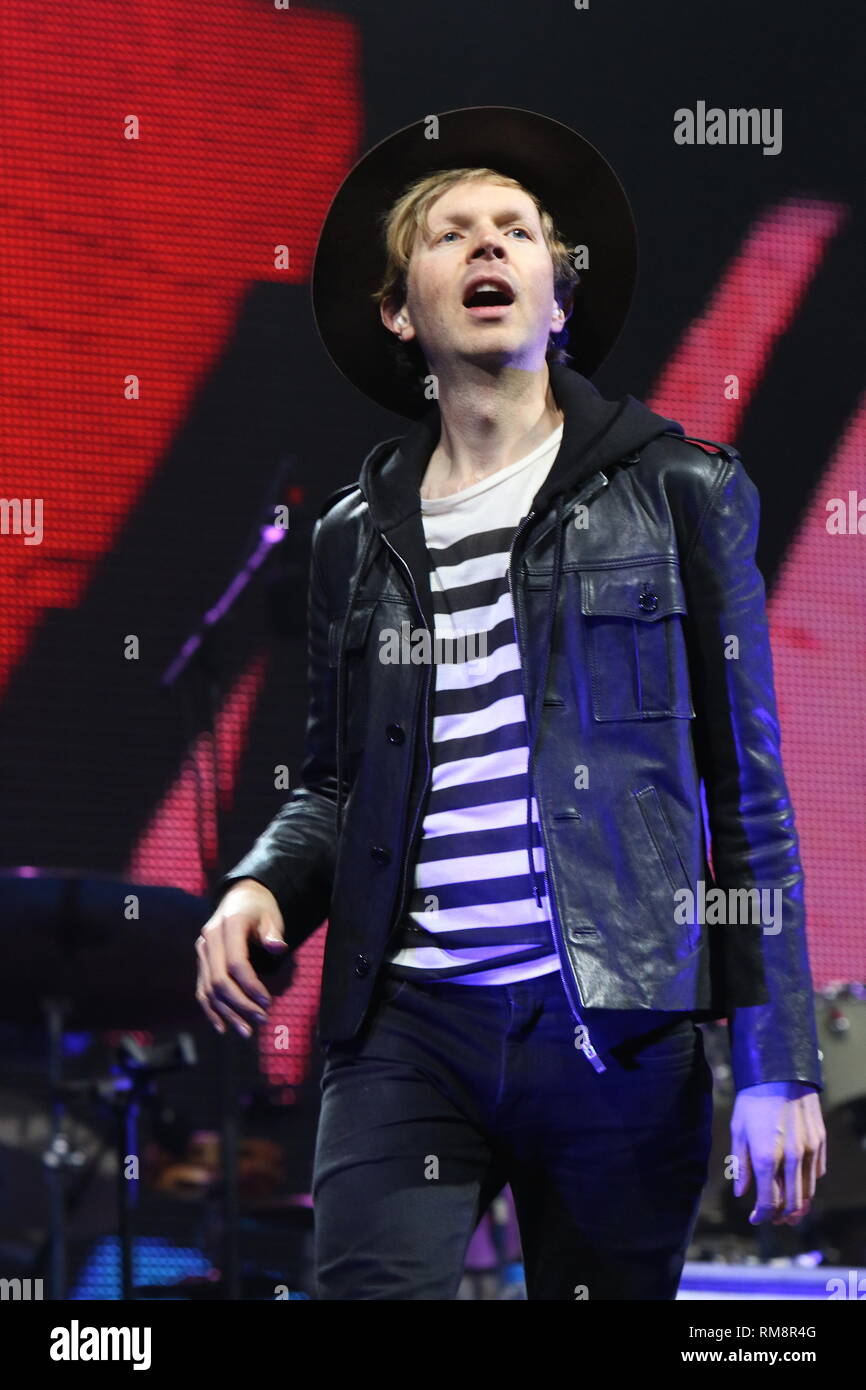 Beck is shown performing on stage during a "live" concert appearance ...