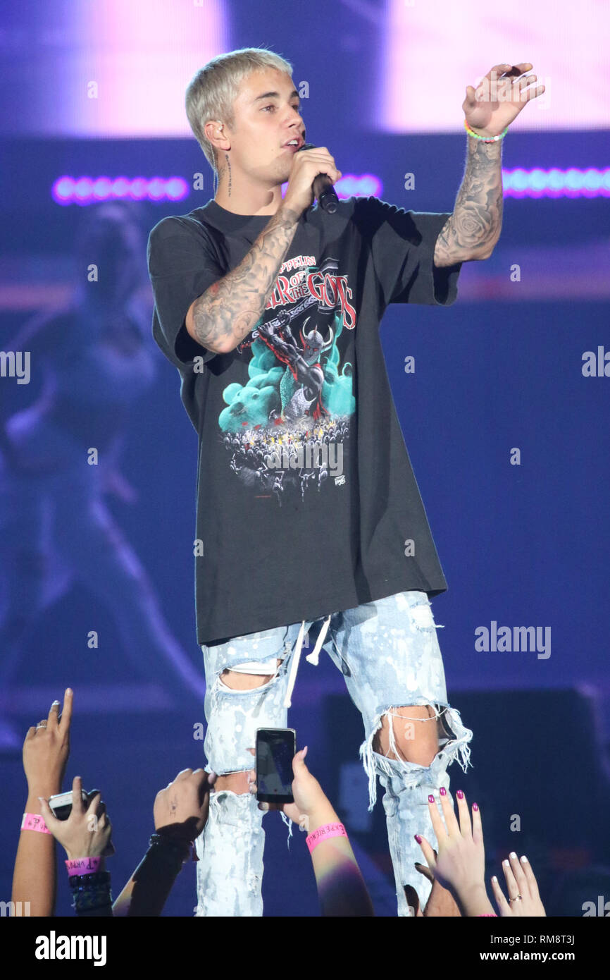 Singer Justin Bieber is shown performing on stage during a "live ...