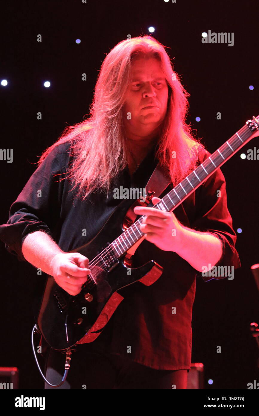 Guitarist Craig Goldy is shown performing on stage during a "live ...