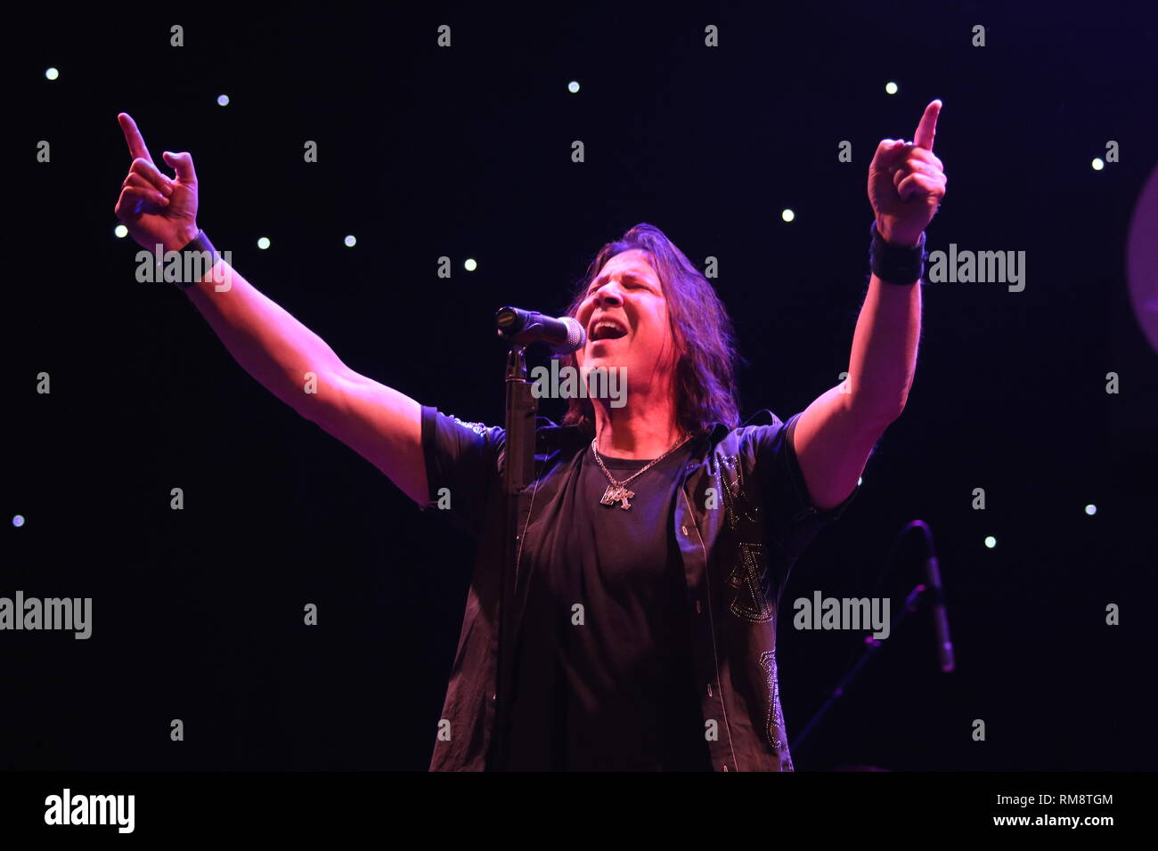 Singer Mark Boals is shown performing on stage during a "live" concert ...