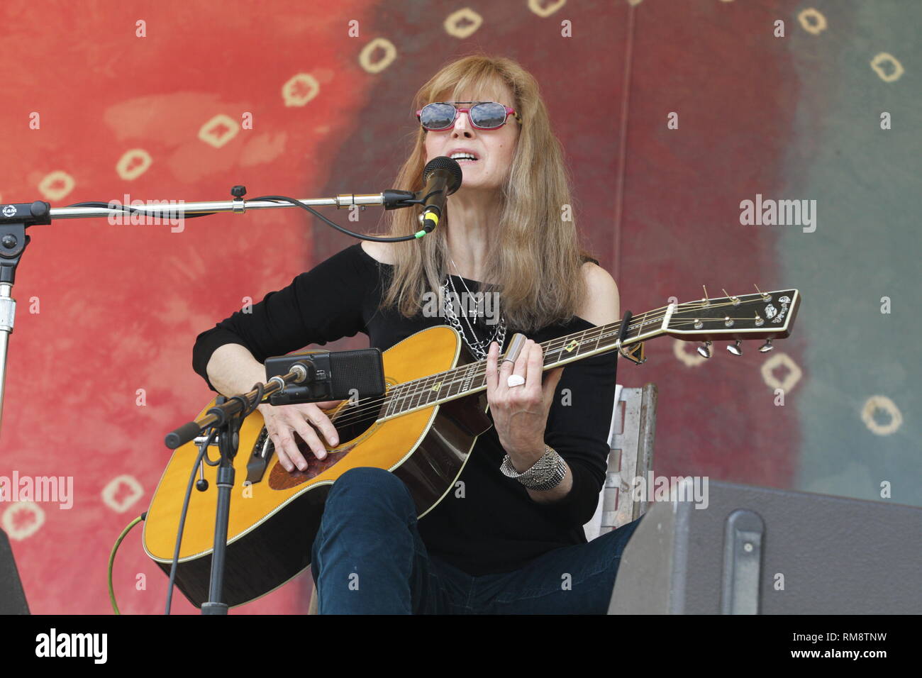 Blues guitarist and singer Rory Block is shown performing on stage ...