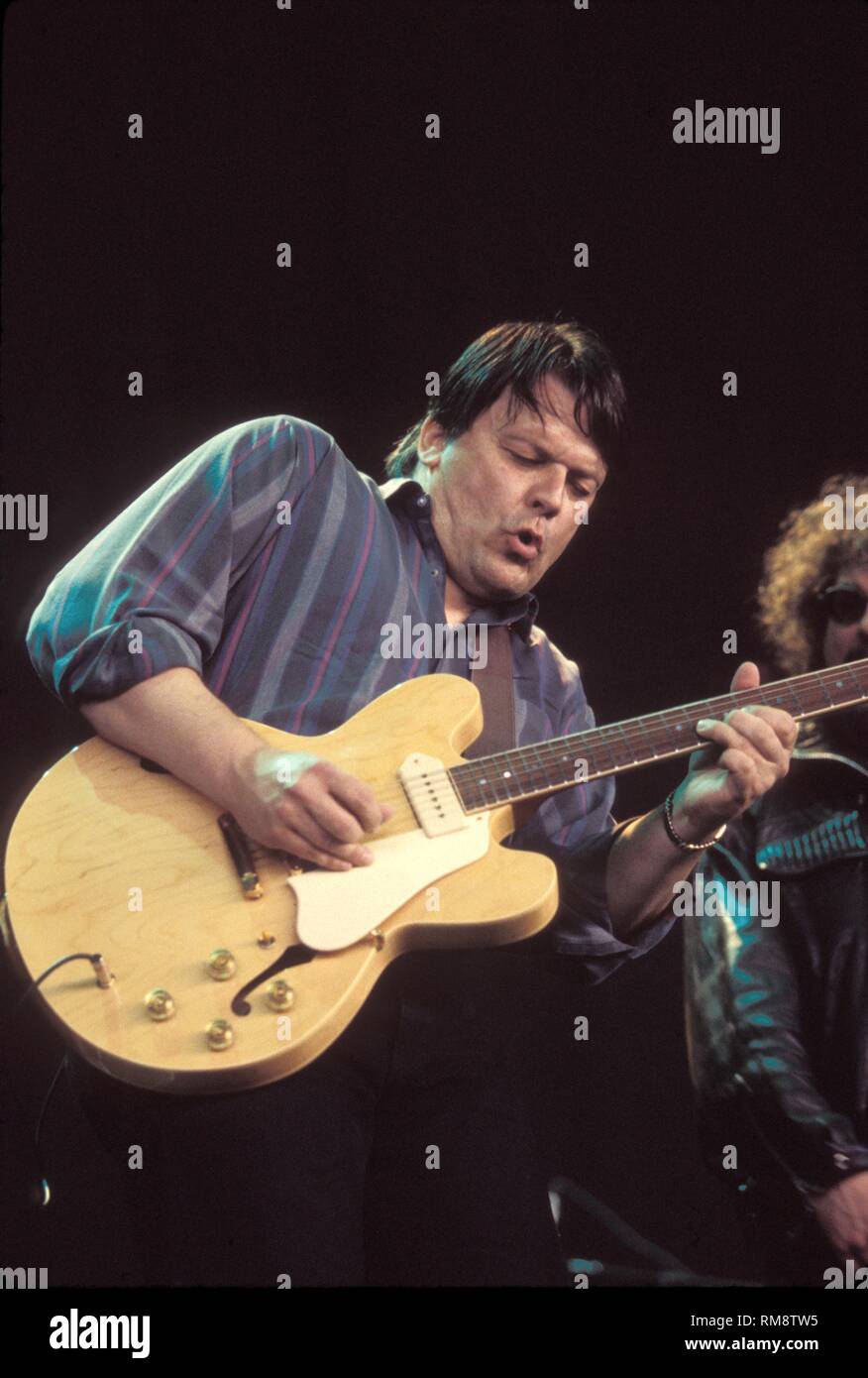 Bluestime guitarist Jay Geils is shown playing his guitar during a concert performance Stock ...