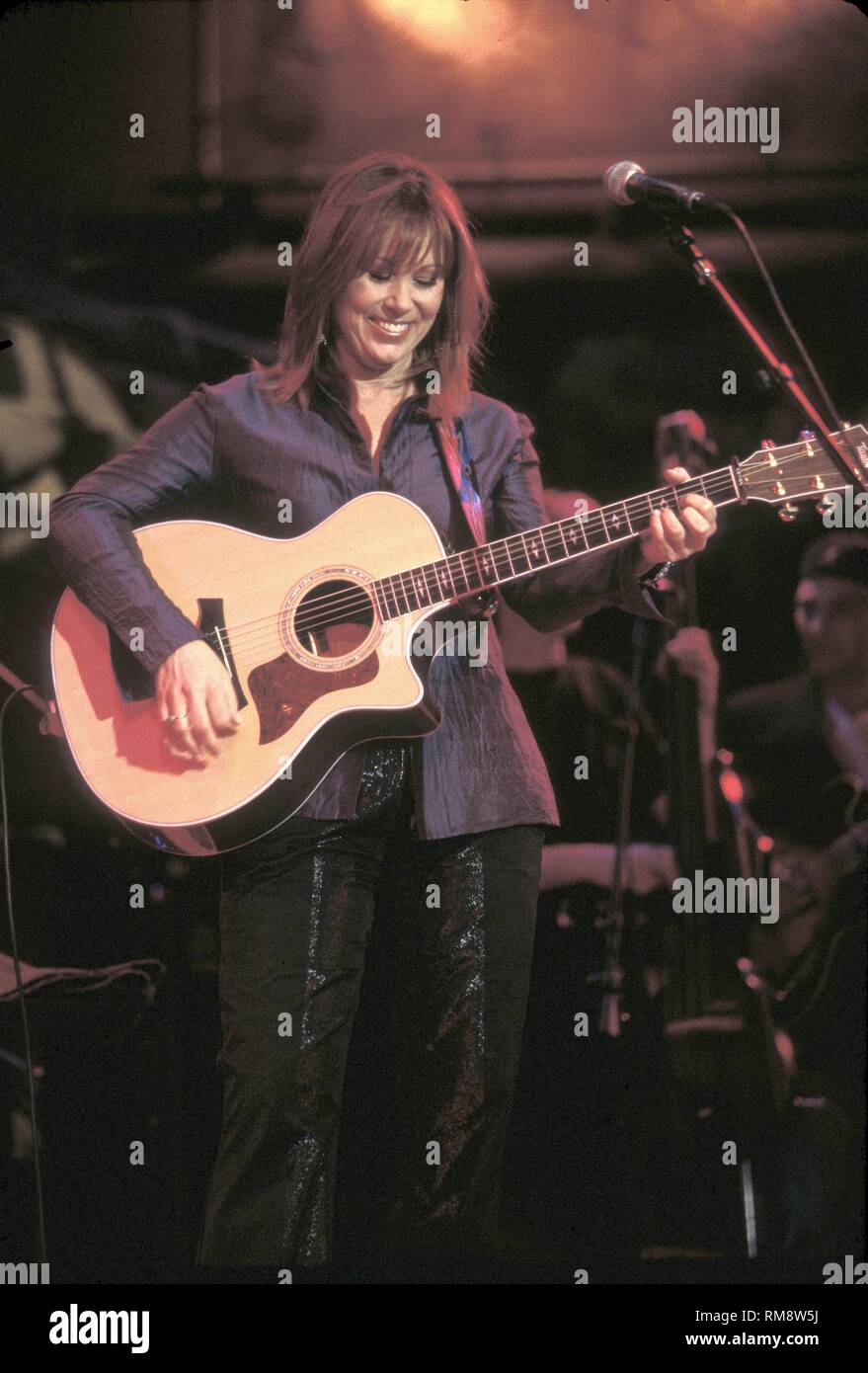 Musician Suzy Boggus is shown performing on stage during a "live ...