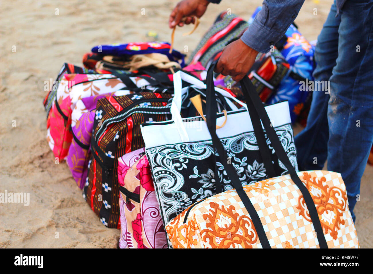 colorful bag at sea beach Stock Photo - Alamy