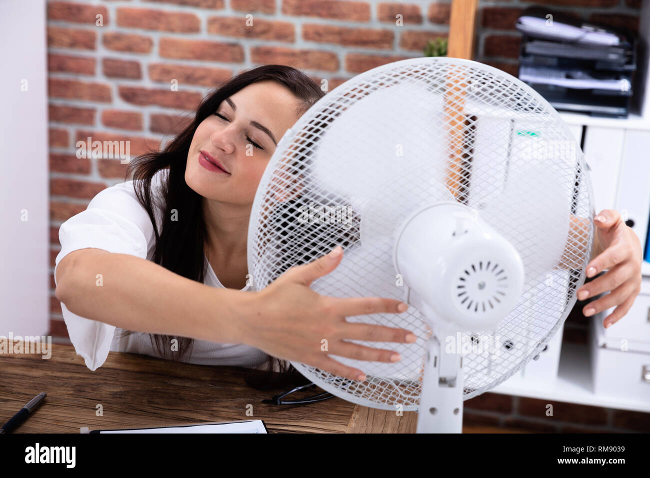 Electric fan woman hi-res stock photography and images - Alamy