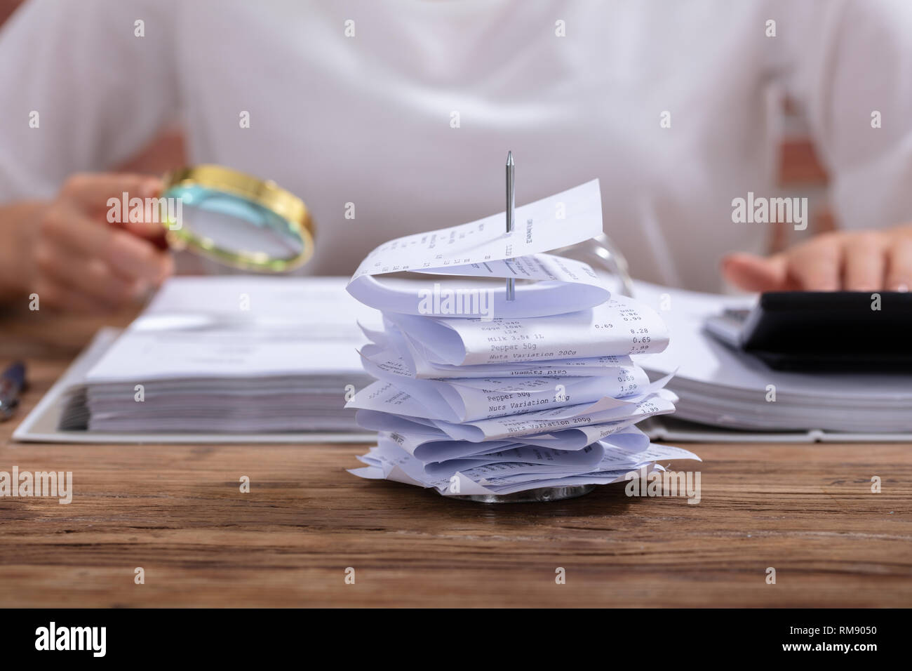 Bills In Front Of A Person Calculating Bills Using Calculator And ...