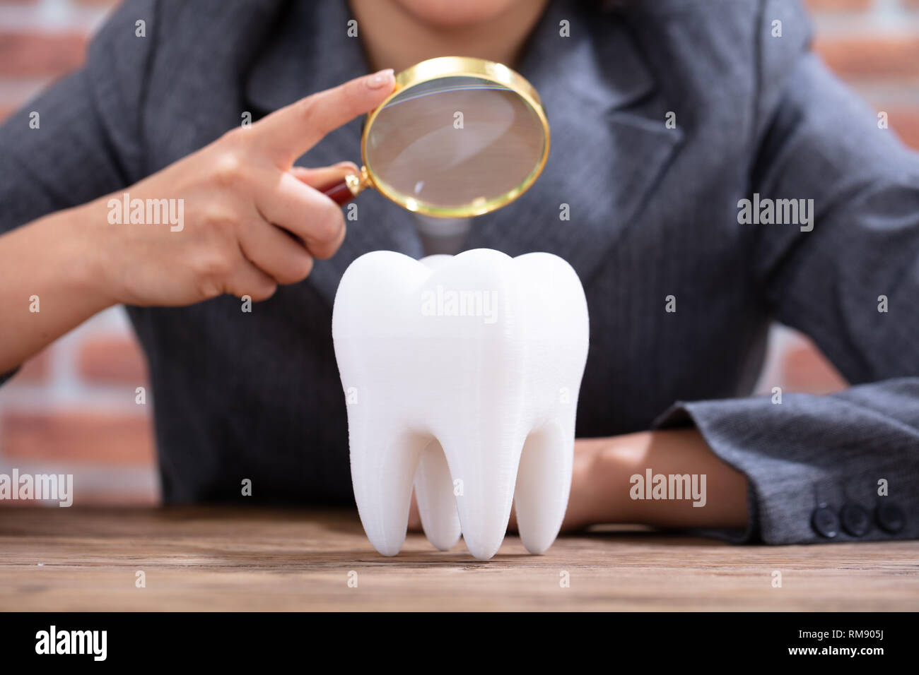 Close-up Of A Person Holding Magnifying Glass Over The Healthy White ...
