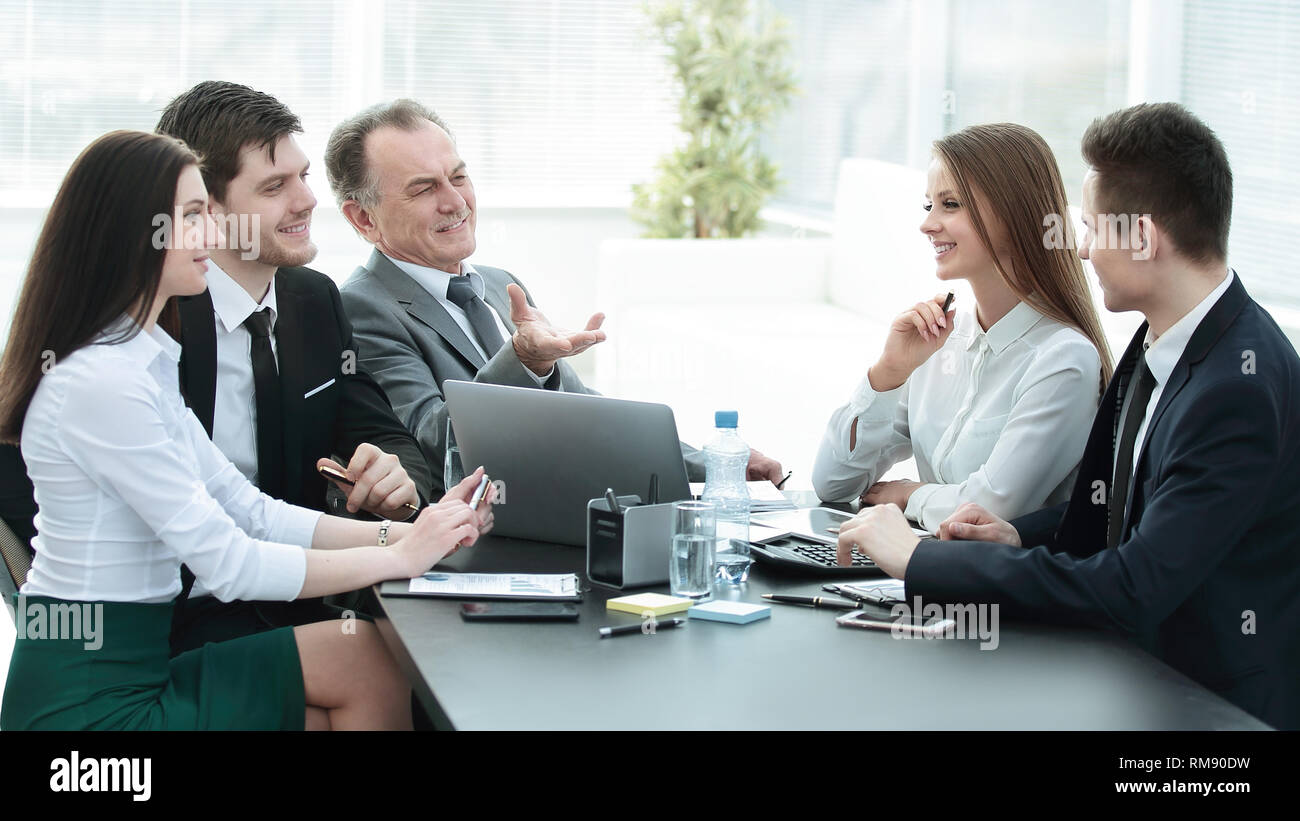 business colleagues talking at Desk in the office Stock Photo - Alamy