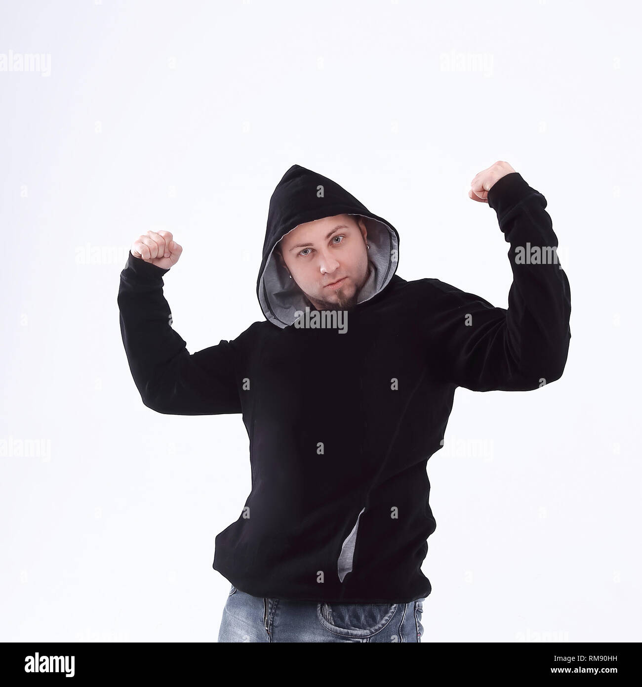 stylish rapper guy showing biceps . isolated on white Stock Photo - Alamy